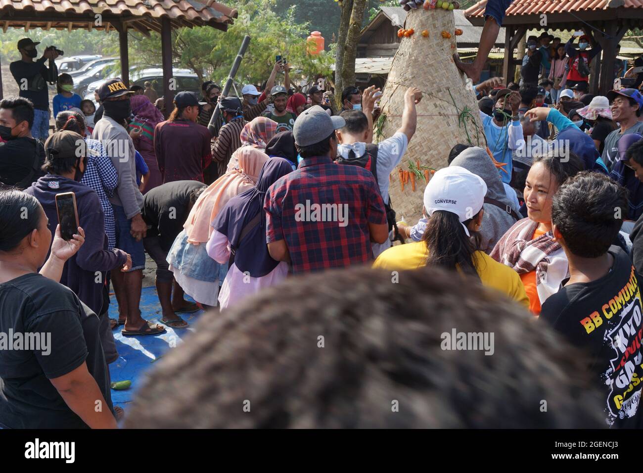 Crowded people celebrating sedekah bumi (javanese thanksgiving) in ...
