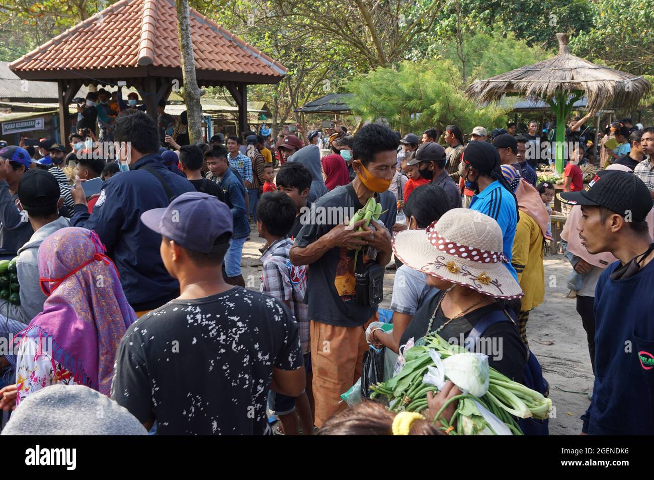 Crowded people celebrating sedekah bumi (javanese thanksgiving) in ...