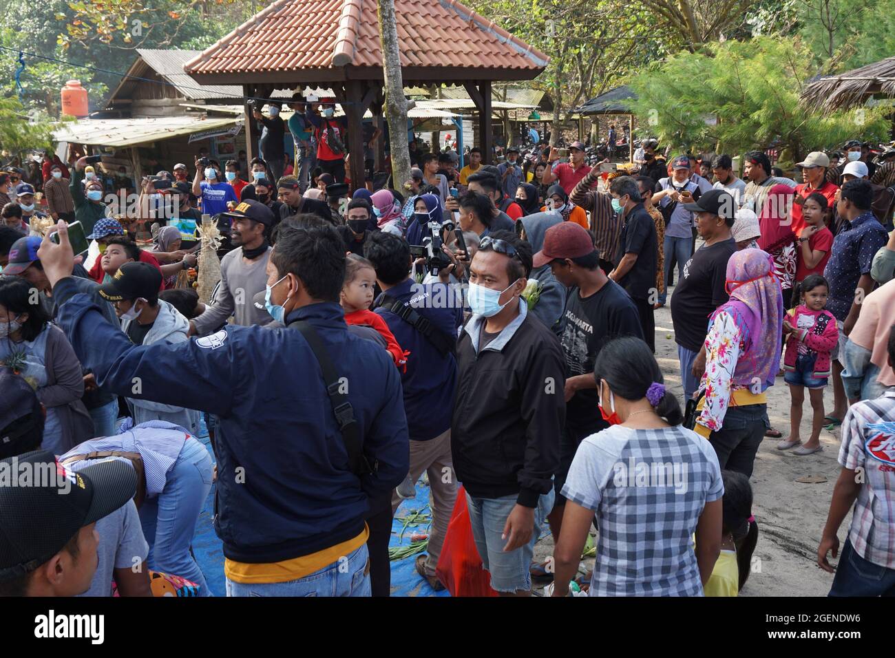Crowded people celebrating sedekah bumi (javanese thanksgiving) in ...