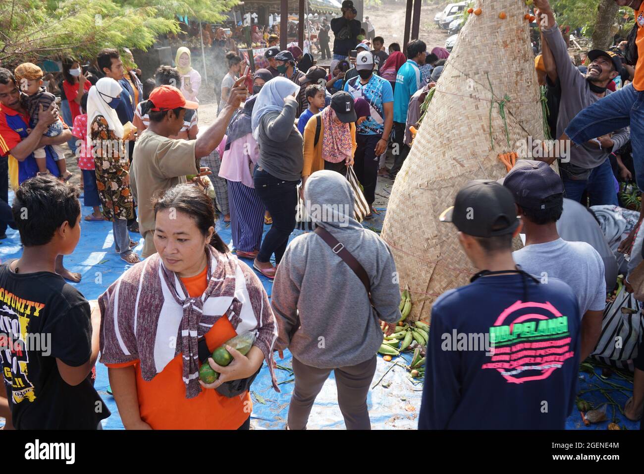 Crowded people celebrating sedekah bumi (javanese thanksgiving) in ...
