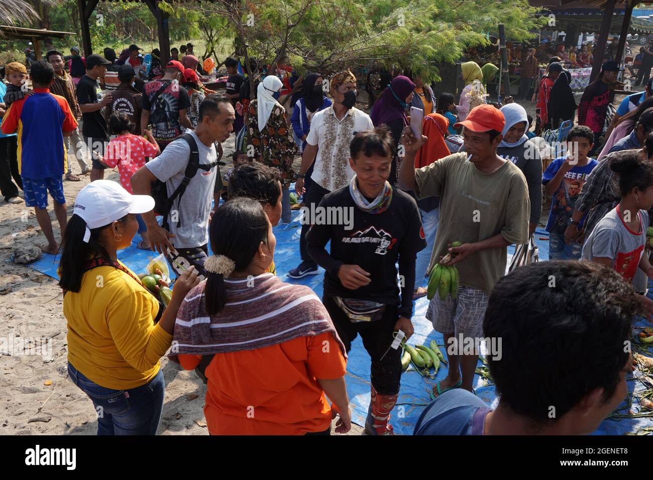 Crowded people celebrating sedekah bumi (javanese thanksgiving) in ...