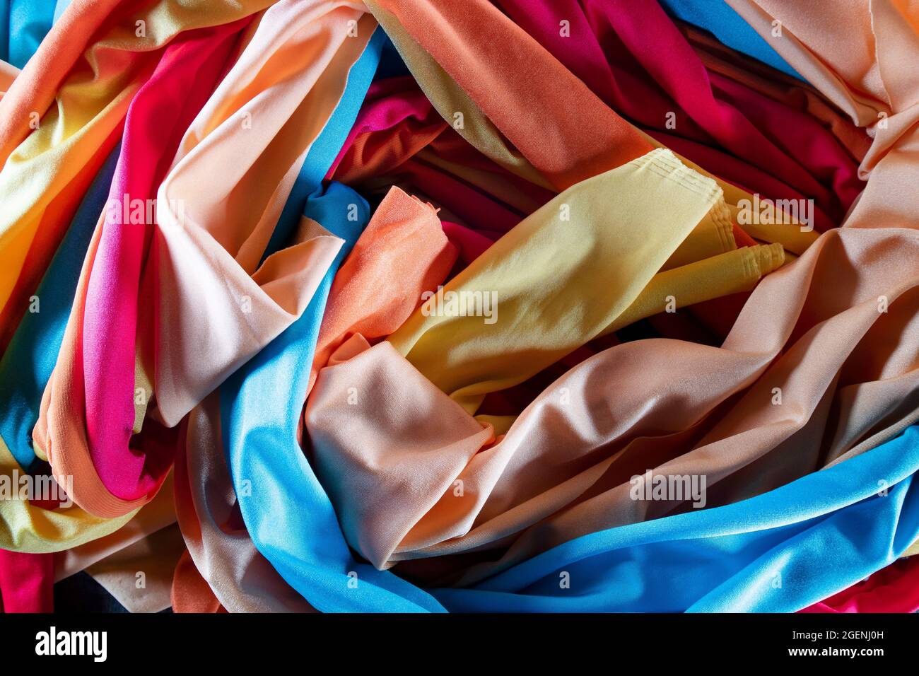 Photographic representation of a group of multicolored cloth drapes ...