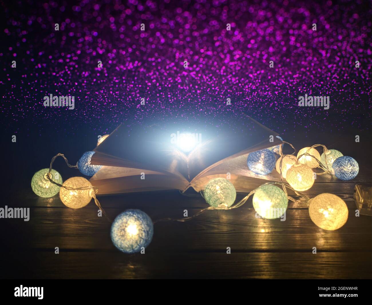 fantasy reading magical image of open antique book over wooden table ...