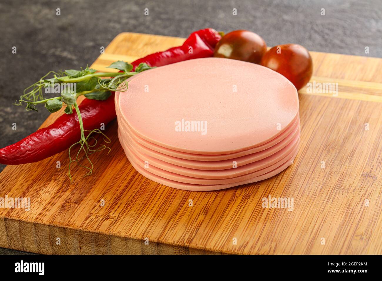 Sliced pork sausages stack over board for snack Stock Photo - Alamy
