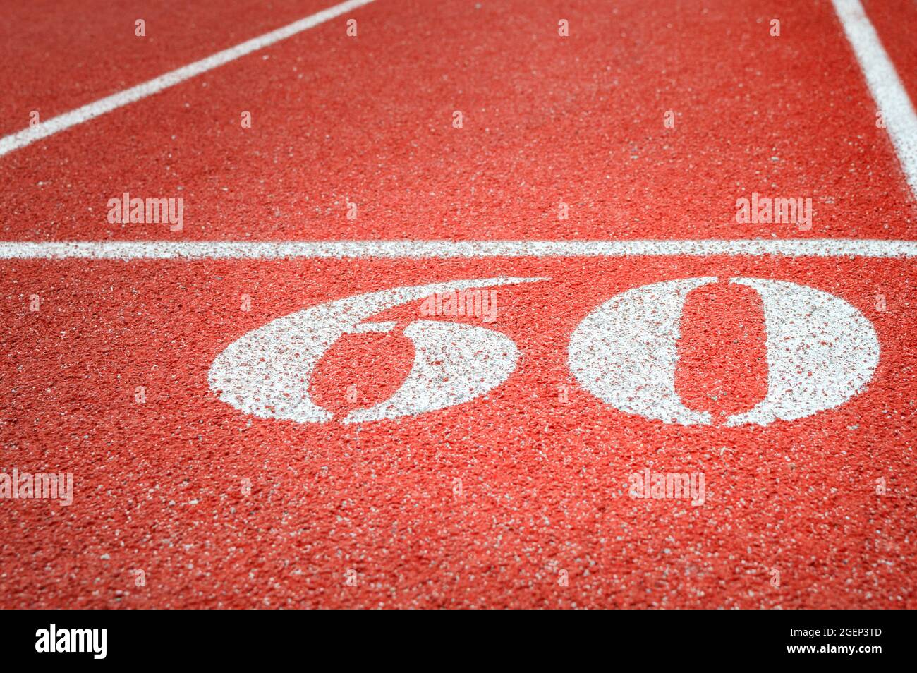 "60" mark on running track. Sign in white numbers and line marked on a ...