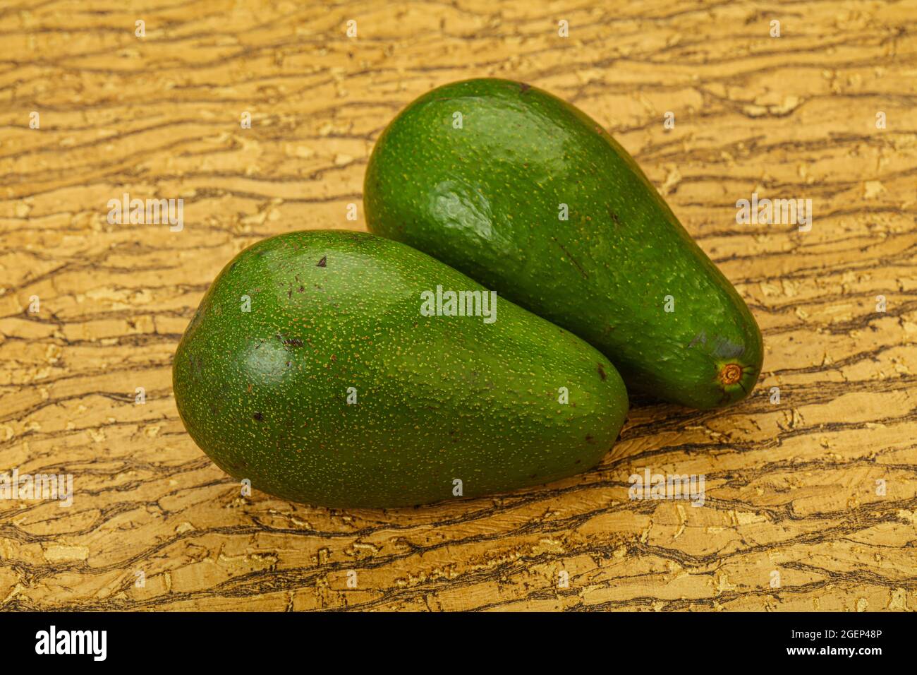 Two ripe exotic green avocado vegetable Stock Photo - Alamy