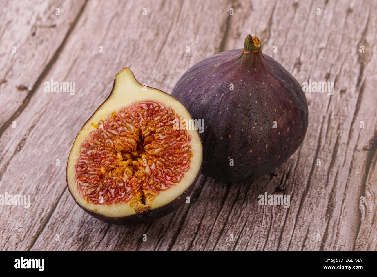 Sweet purple slice of fig fruit Stock Photo - Alamy