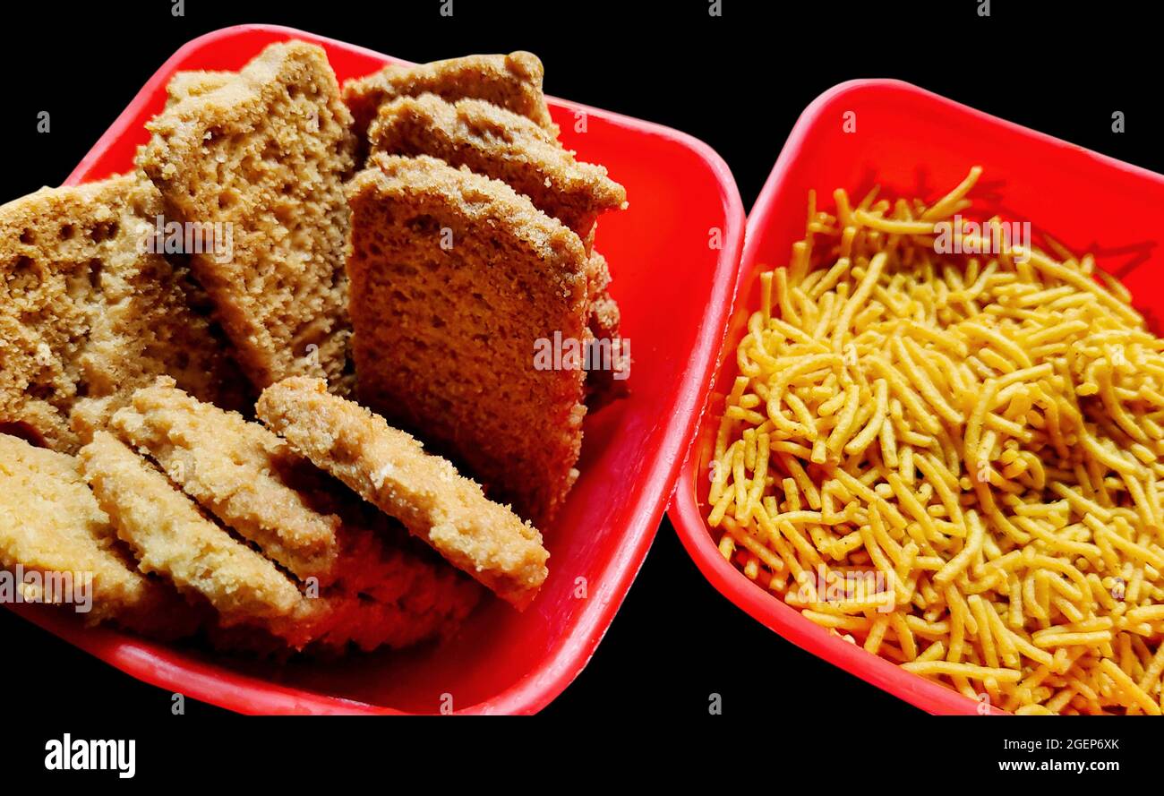 Tea and snacks with sweets for guests in india Stock Photo - Alamy