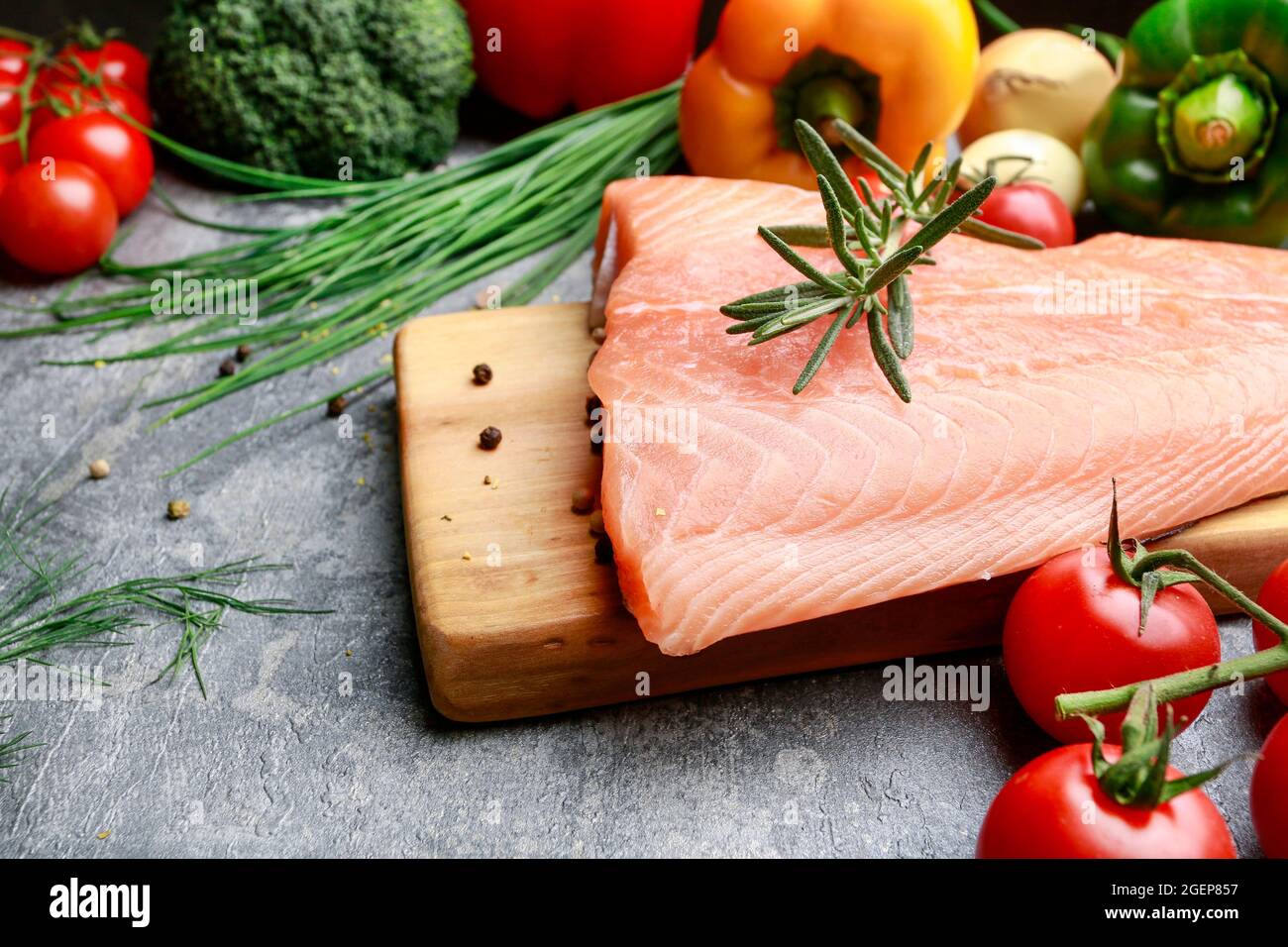 Raw fishes and vegetables on stone background, healthy food Stock Photo ...