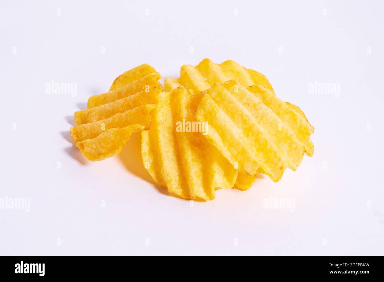 Corrugated chips isolated on white background, wavy potato chips ...