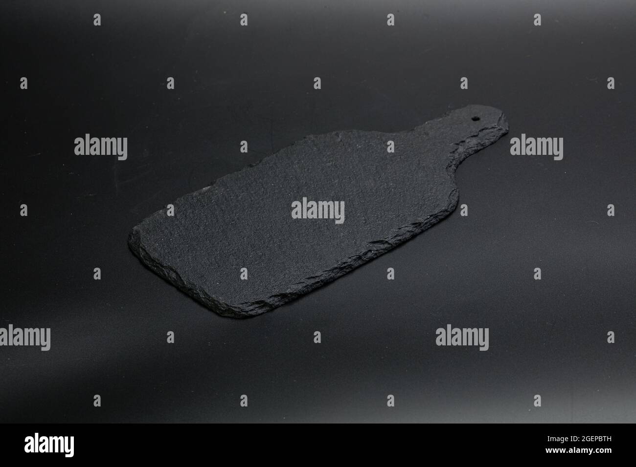 Black stone table plate for kitchen isolated Stock Photo - Alamy