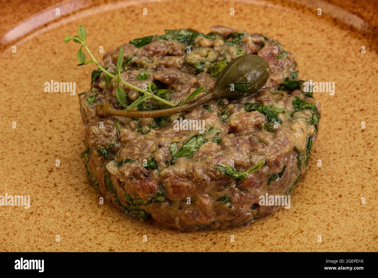 Raw beef tartar snack with capers Stock Photo - Alamy