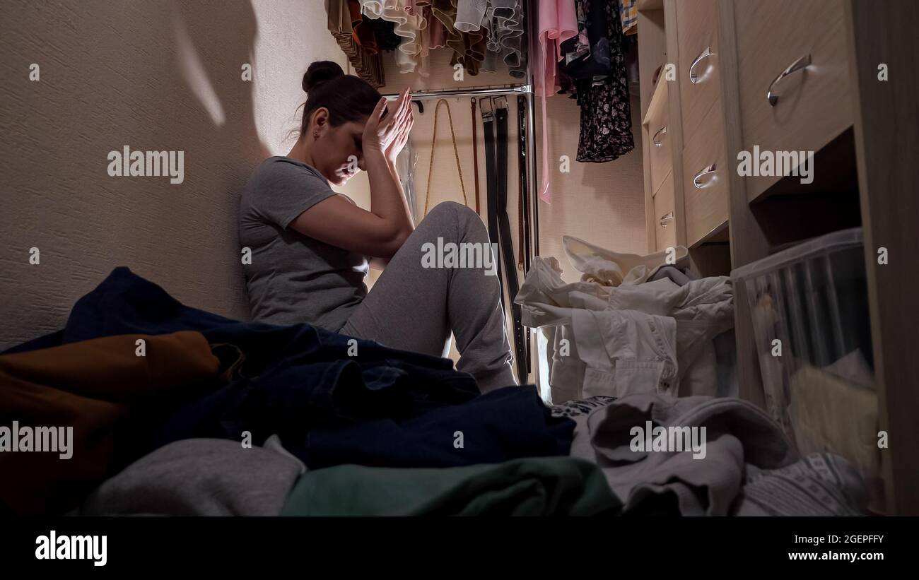 Woman pile of clothes closet hi-res stock photography and images - Alamy