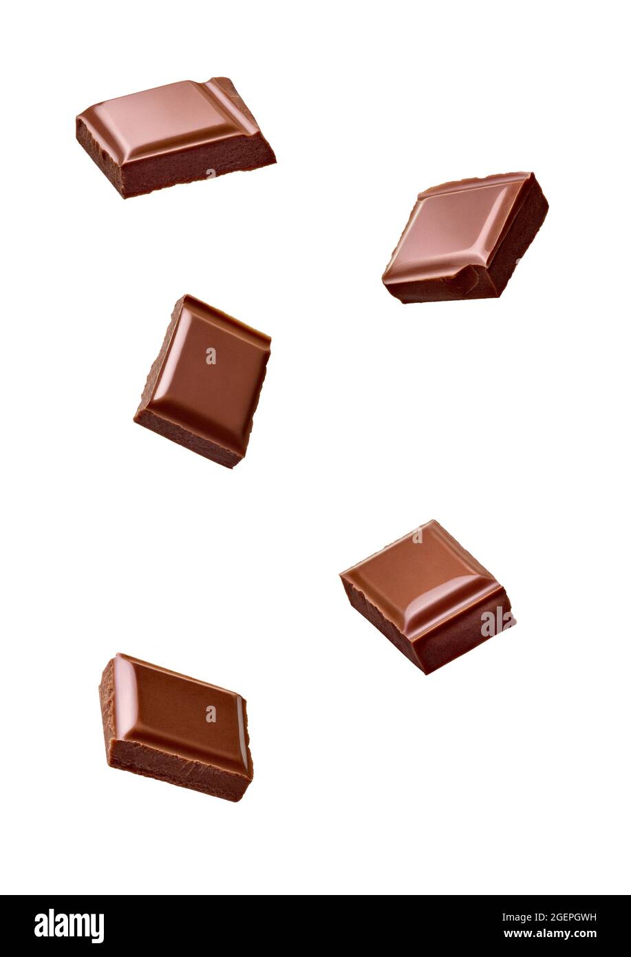 close up of chocolate pieces stack falling on white background Stock ...