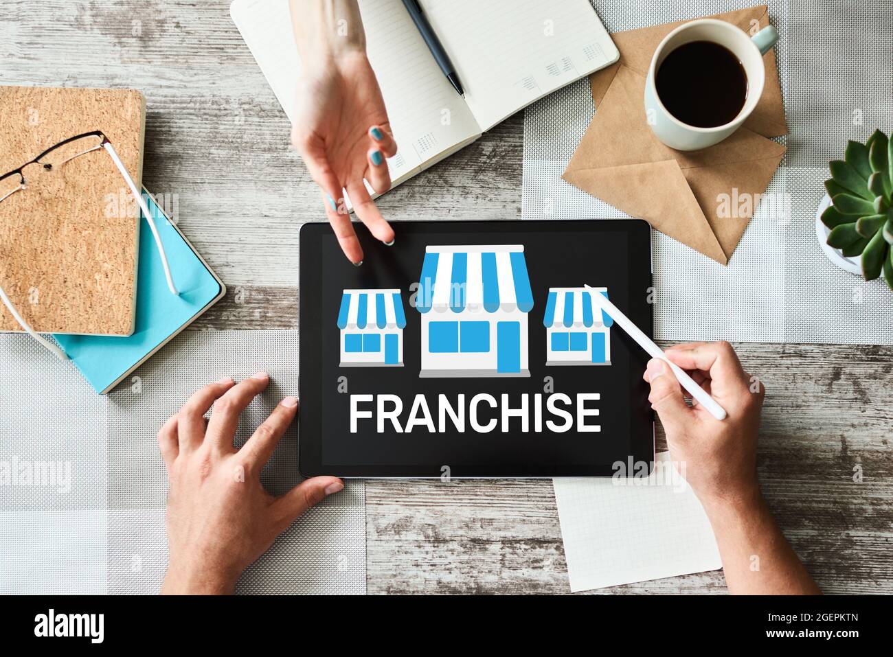 Franchise business model and growth concept on device screen Stock ...