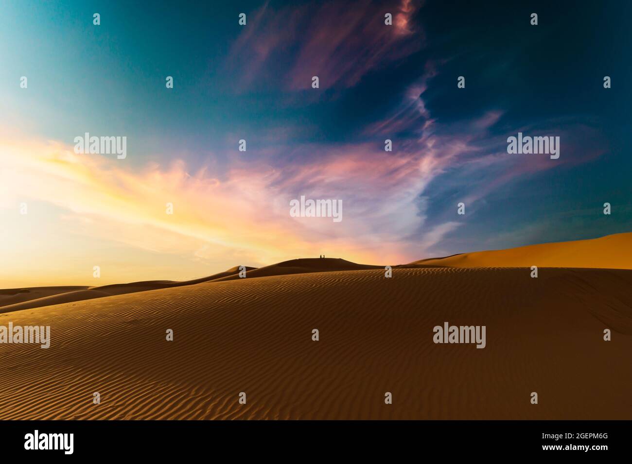 (Selective focus) Stunning sunset over some sand dunes of the Merzouga ...