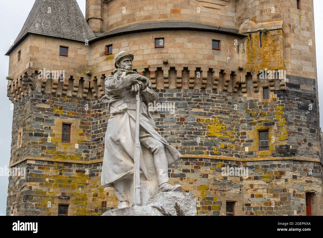 Sculpture in front of the scenic medieval castle of Vitre in Brittany ...