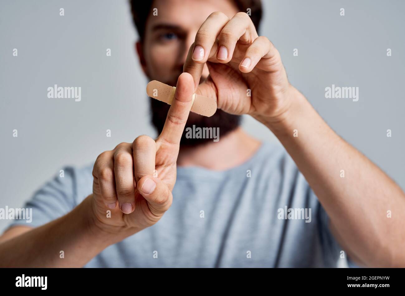 man with injured finger patch health treatment care Stock Photo - Alamy