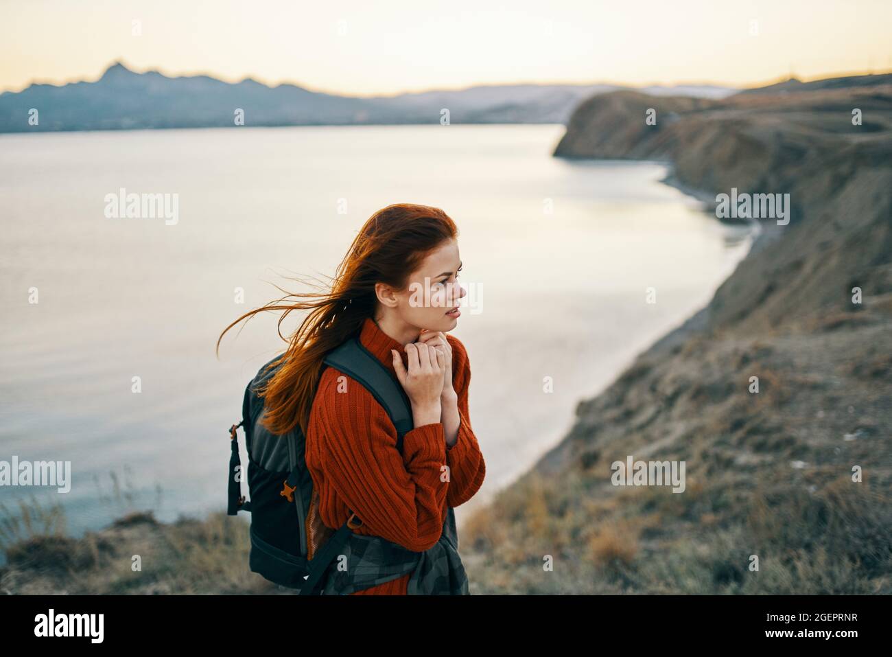 Back view woman walking the desert sunset hi-res stock photography and ...
