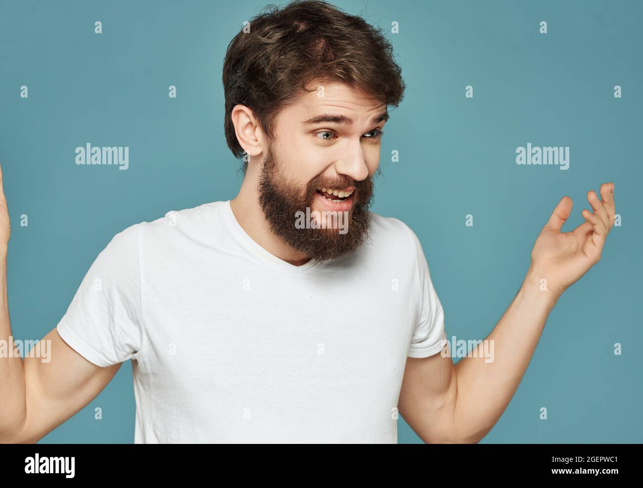 emotional man in a white t-shirt irritated facial expression Lifestyle ...
