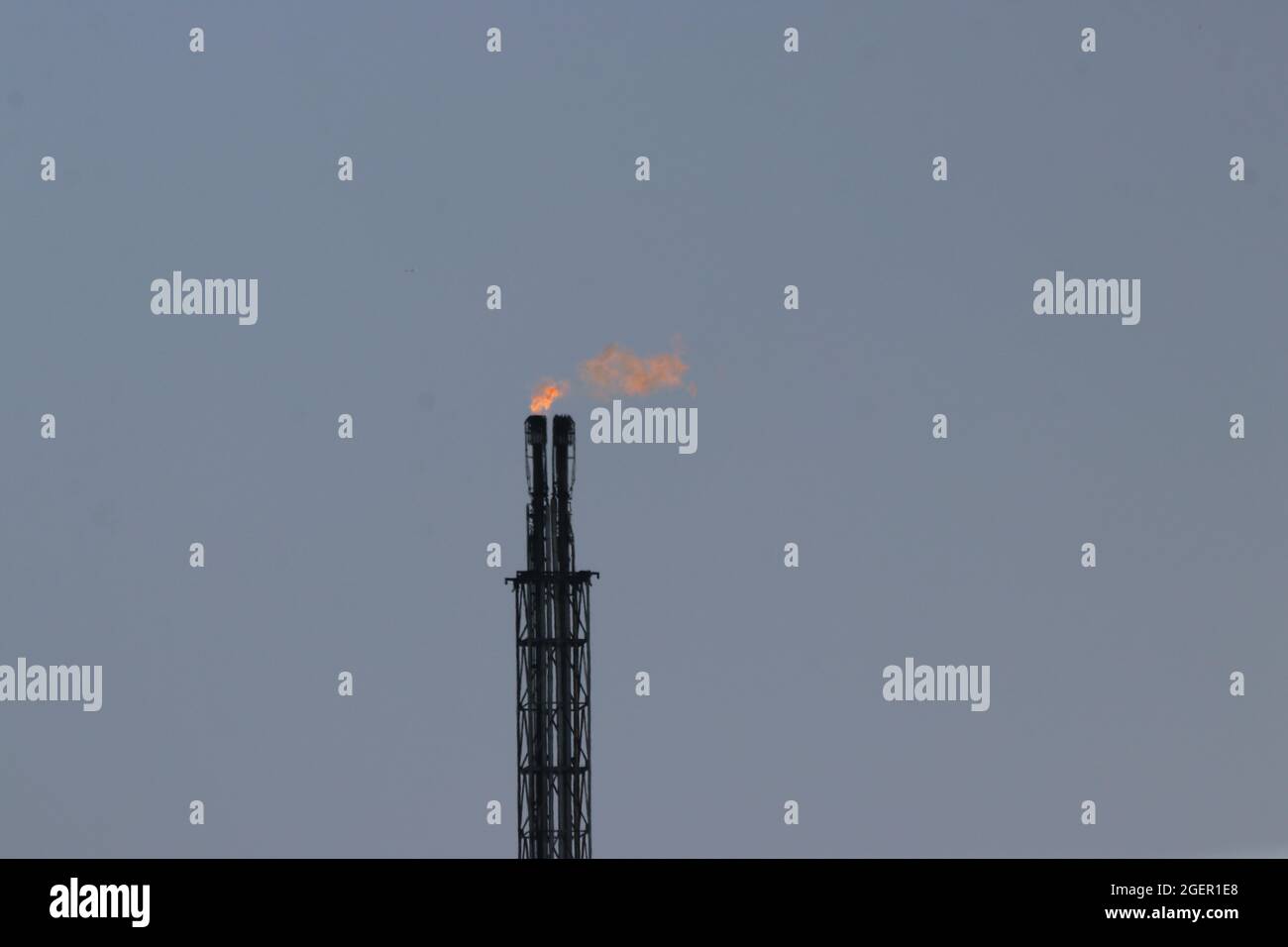 Flare on flarepipe at the Shell refinery in the Pernis Harbor in ...