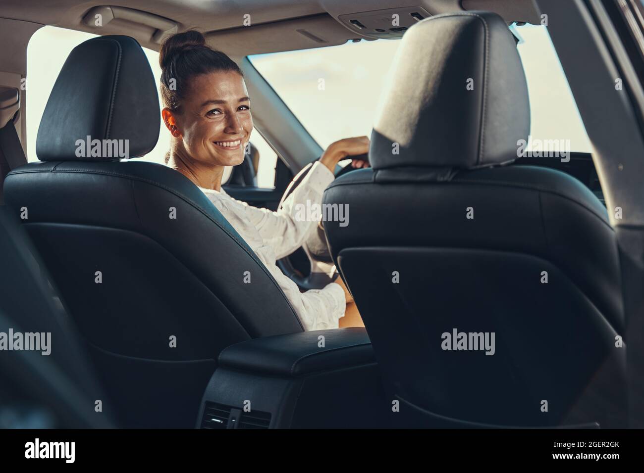 Cheerful female person turning hi-res stock photography and images - Alamy