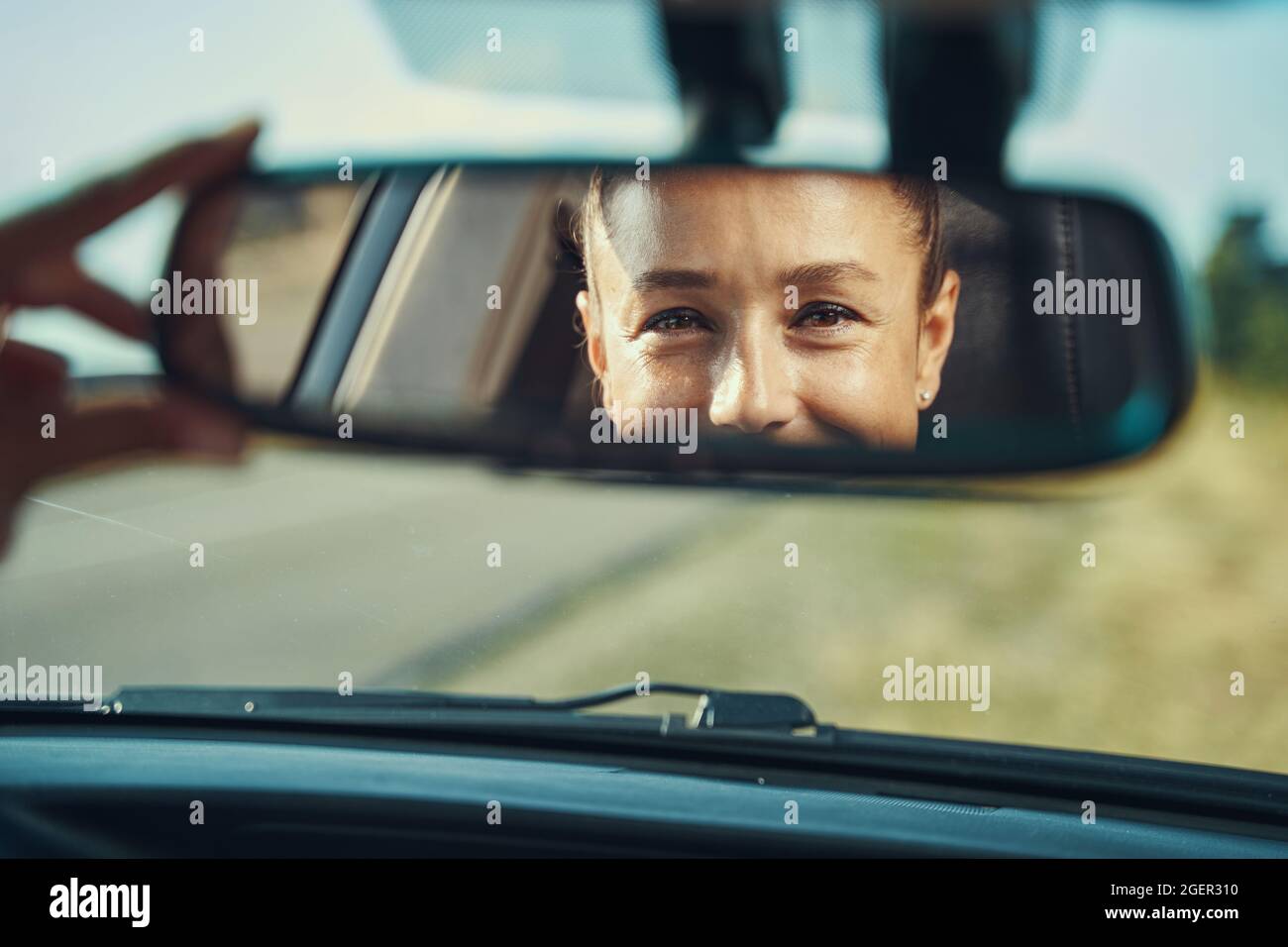 Face in rear view mirror hi-res stock photography and images - Alamy