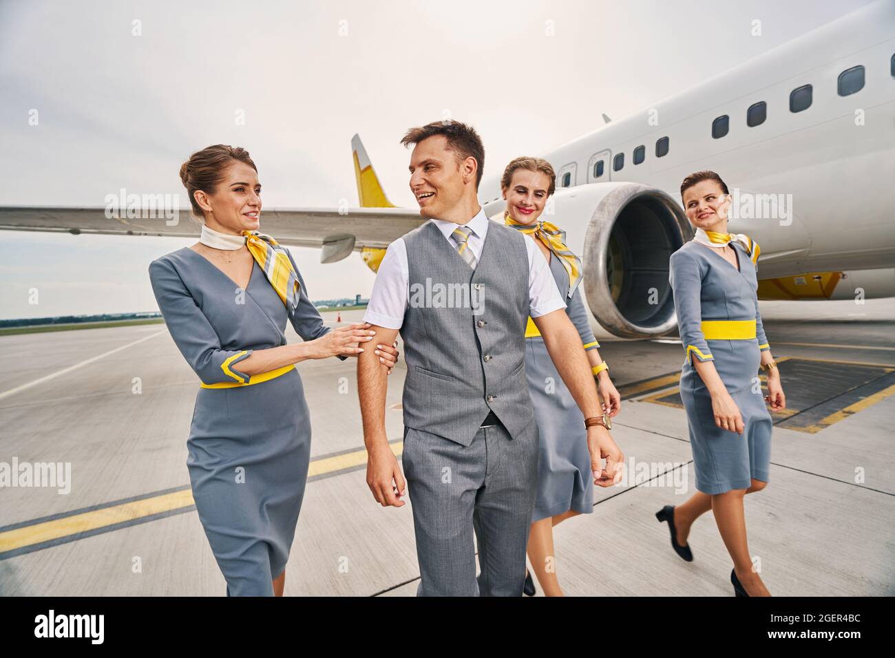 Elegant cabin crew in hi-res stock photography and images - Alamy