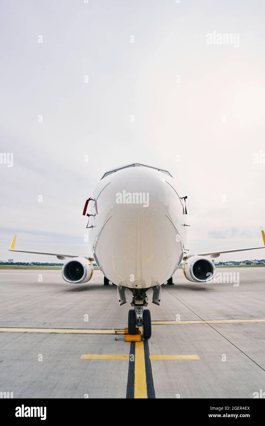 Nose of a landed civil aircraft parked on the runway Stock Photo - Alamy