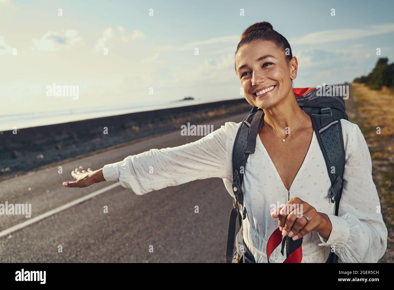 Hitchhiker with sign hi-res stock photography and images - Alamy