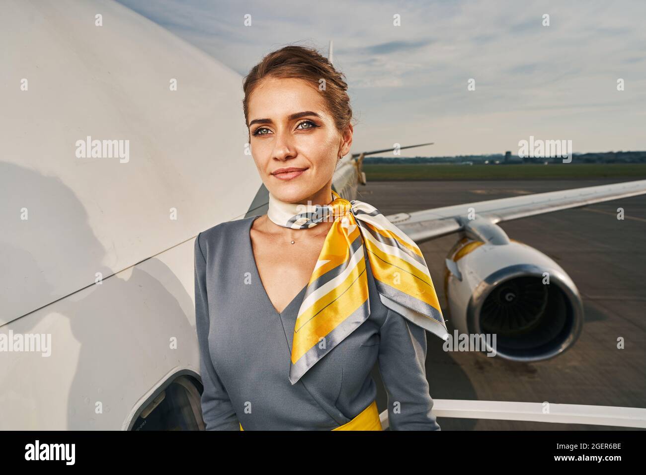 Pensive pretty stewardess staring into the distance Stock Photo - Alamy