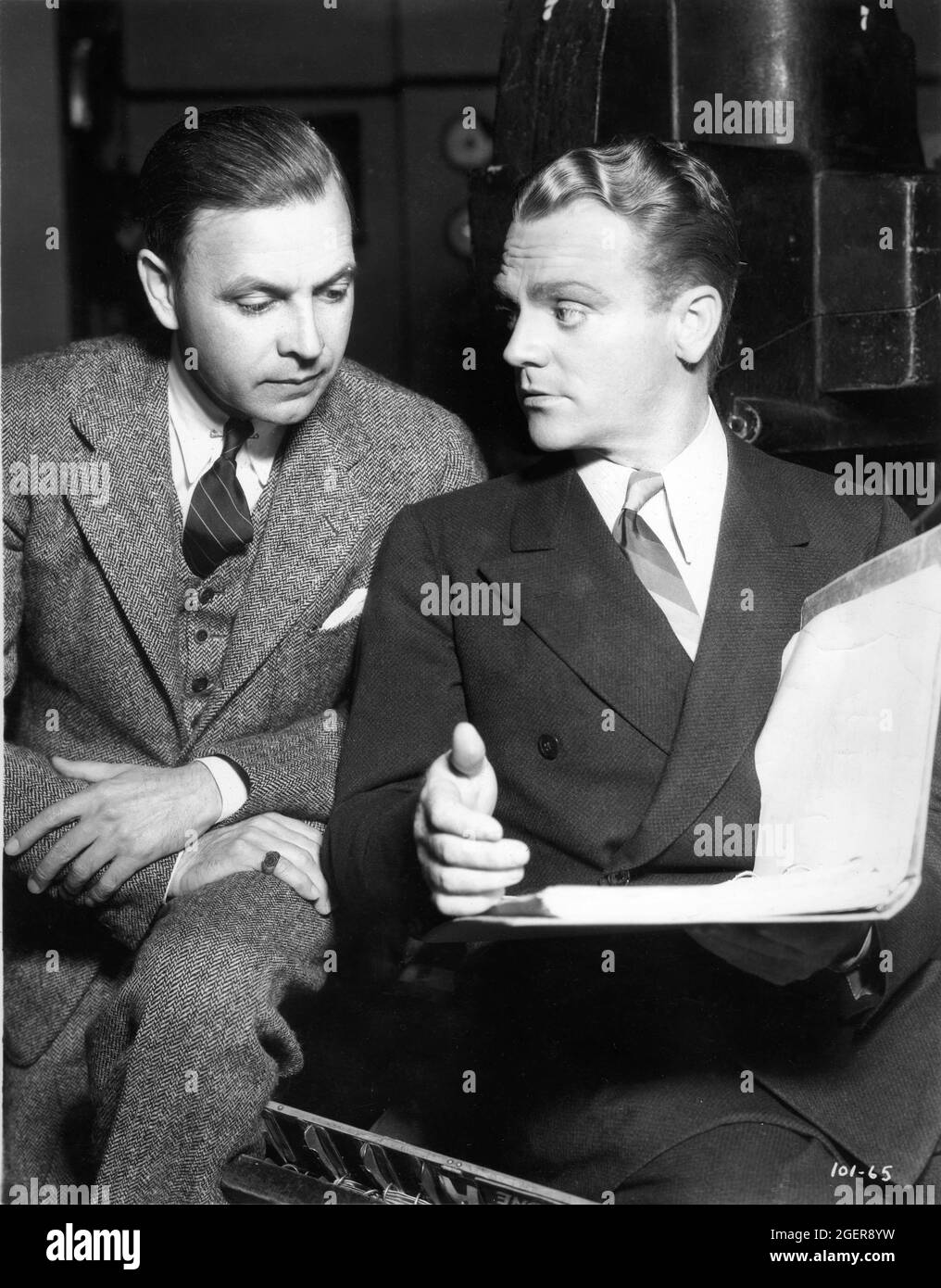 Producer DOUGLAS MacLEAN and JAMES CAGNEY on set candid checking script ...