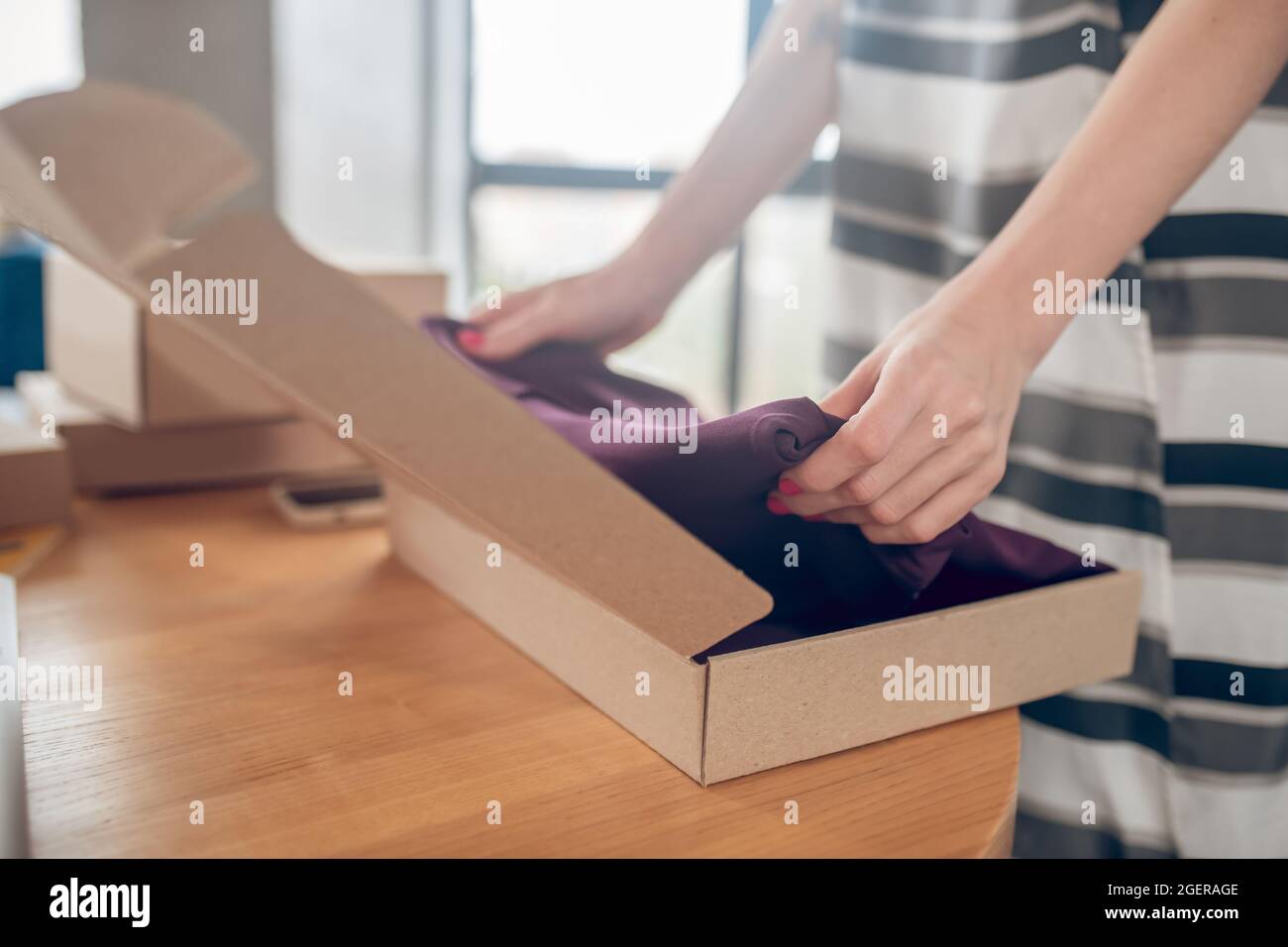 Garments packing hi-res stock photography and images - Alamy