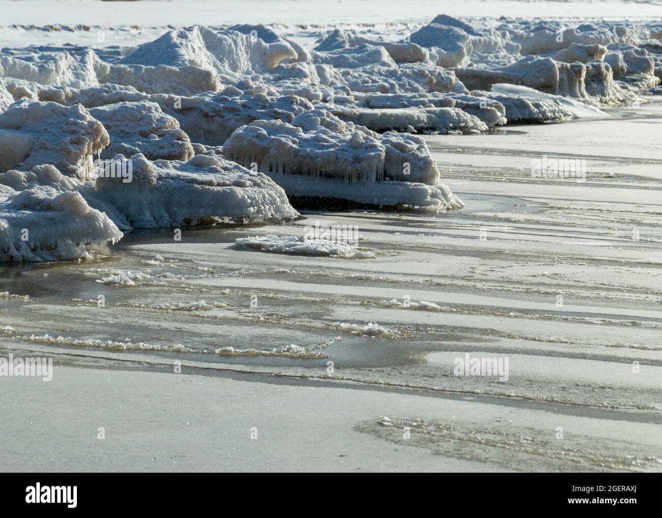 winter landscape by the sea, snowy pieces of ice by the sea and ice ...