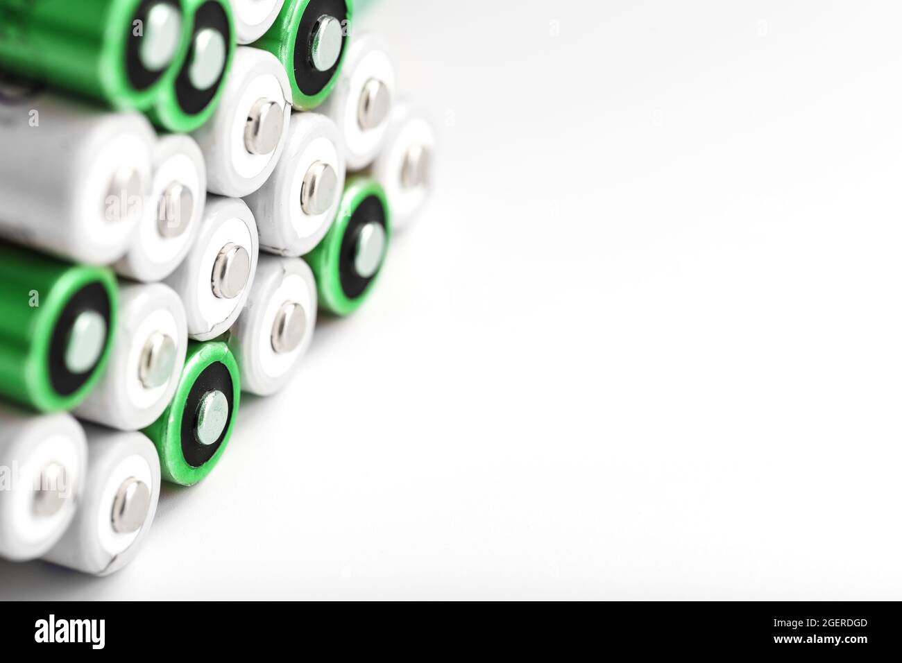 Pyramids of AA batteries on a white background with free space. The ...