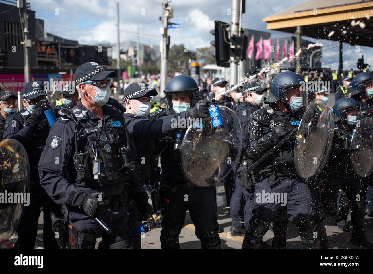 Melbourne, Australia. 21st August 2021. Riot squad officers use pepper ...