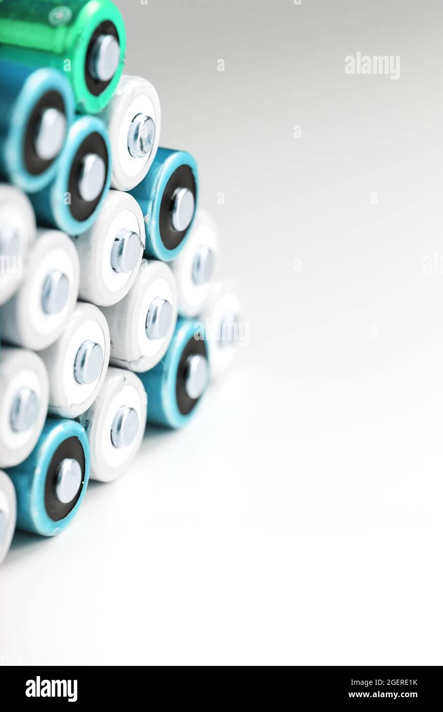 Pyramids of AA batteries on a white background with free space. The ...