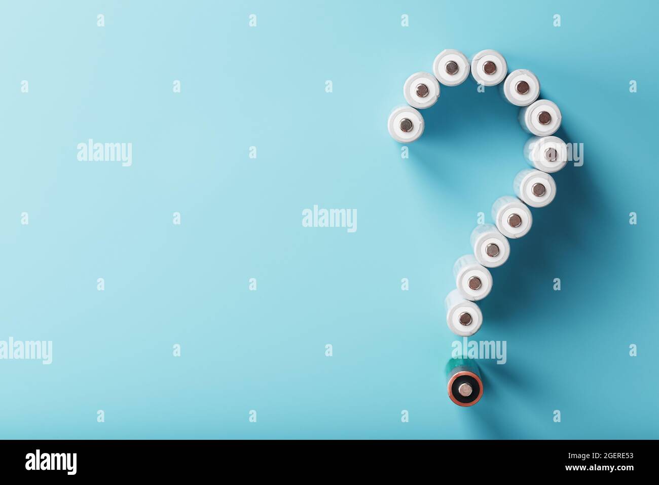 AA rechargeable batteries in the form of a question mark on a blue ...