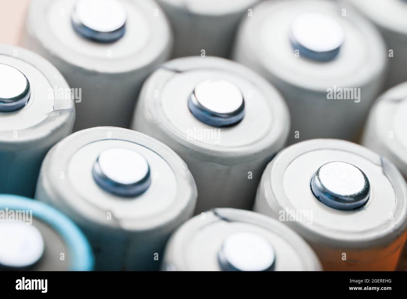 AA batteries as a texture background in full screen. The concept of ...