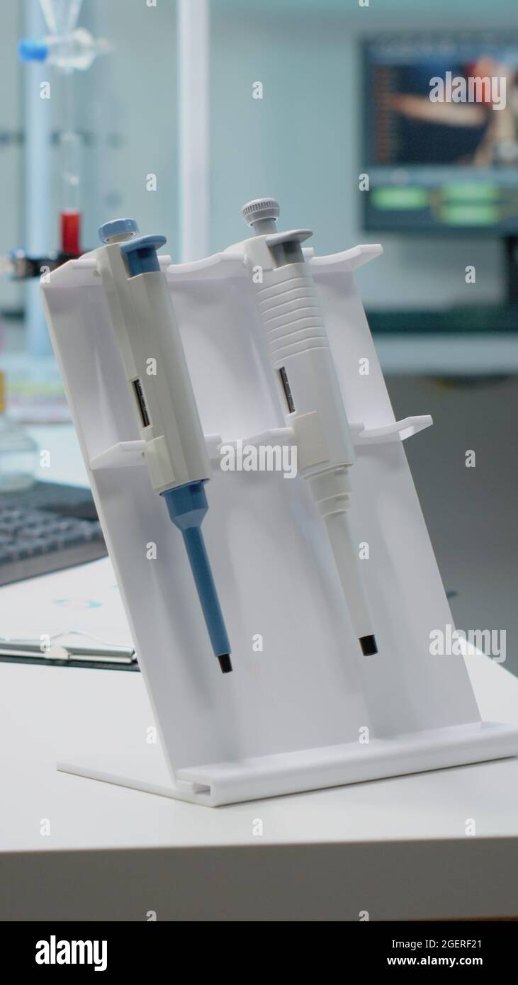 Scientific micropipette and microscope in laboratory designed for ...