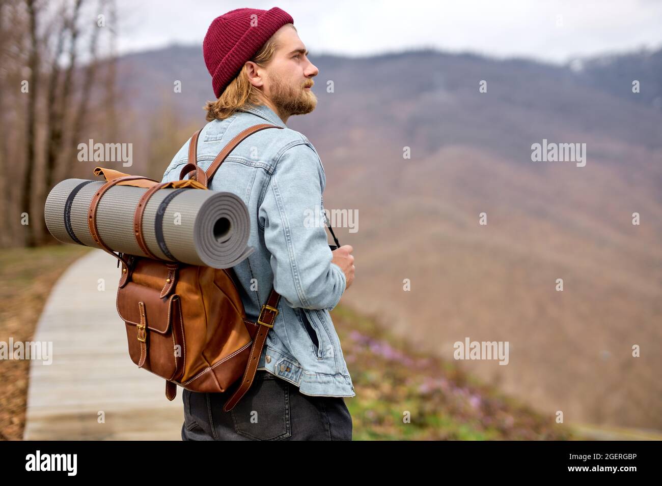 male traveler walking, going to explore wild environment at spring ...