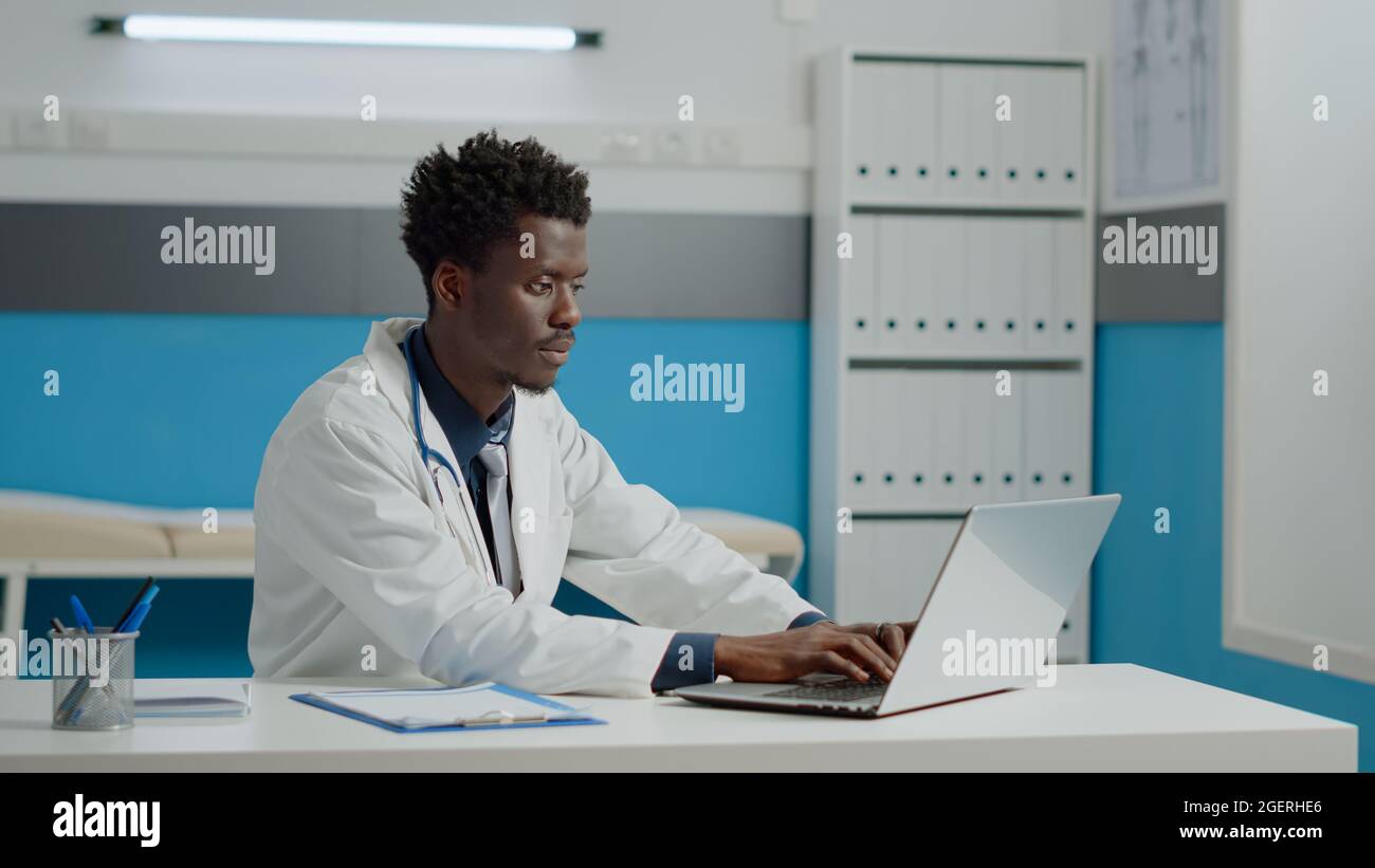 Portrait of healthcare specialist looking at camera while smiling in ...