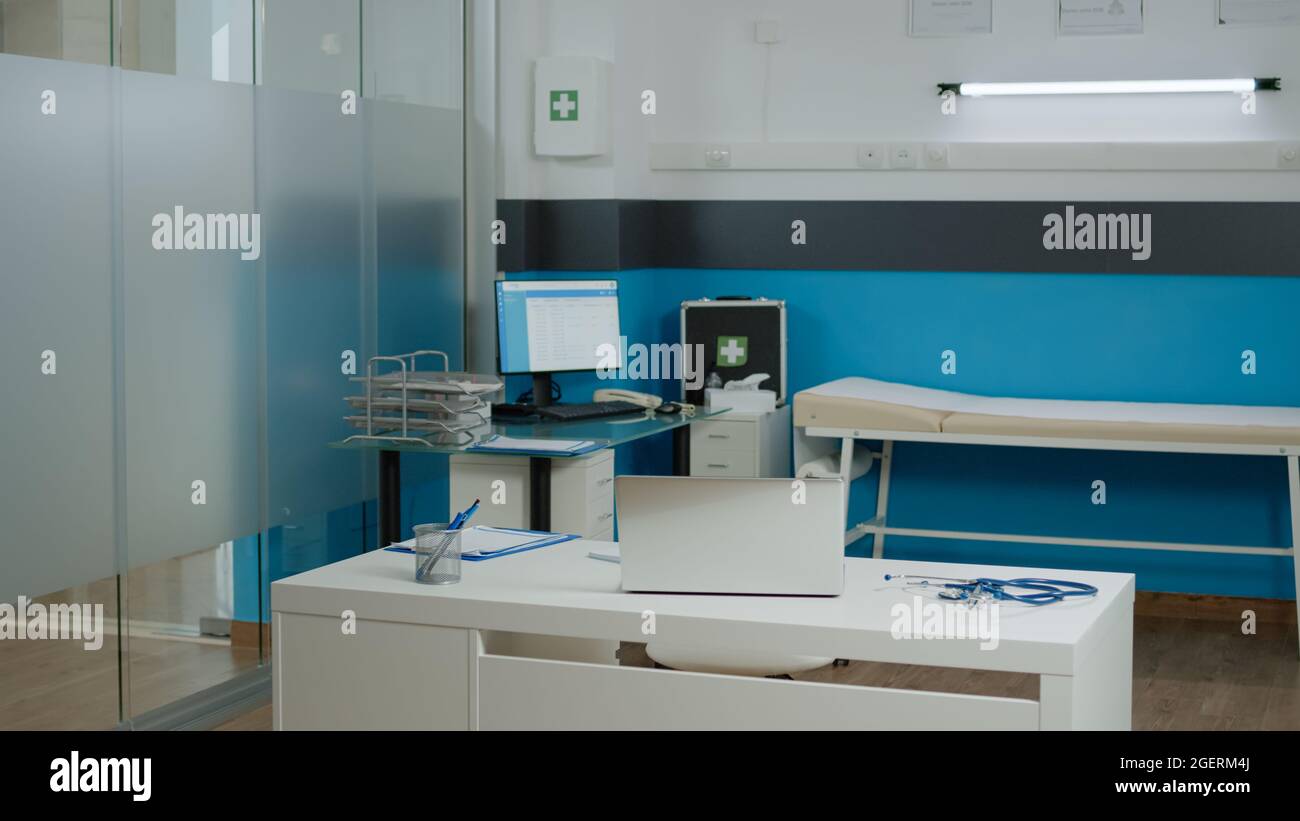 Empty doctors office with medical instruments at facility for ...