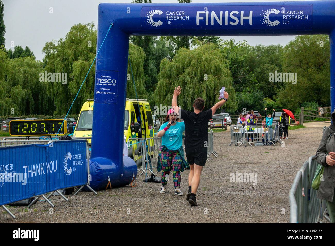 A man running the Cancer Research Race for Life on Hampstead Heath ...