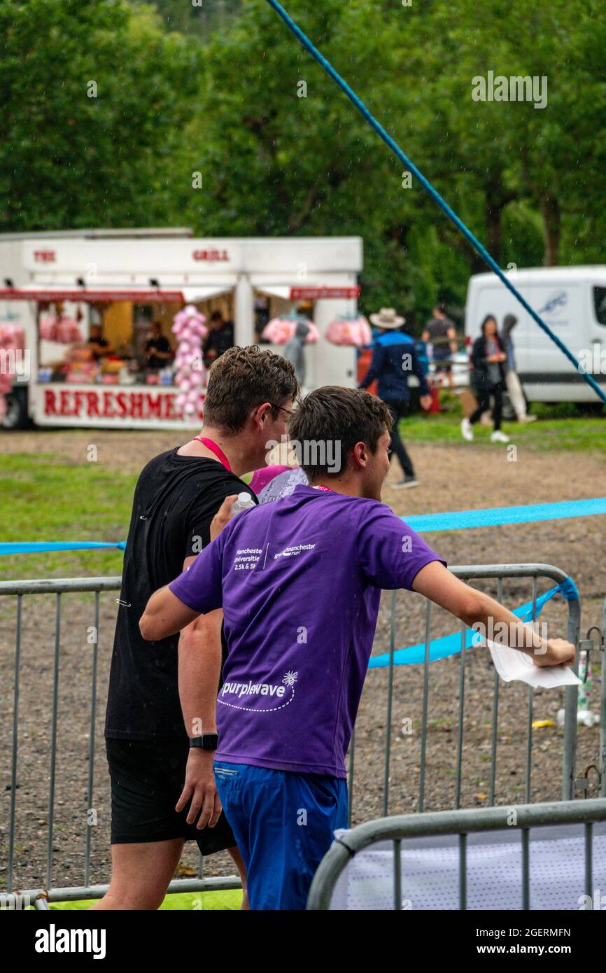 A man running the Cancer Research Race for Life on Hampstead Heath ...