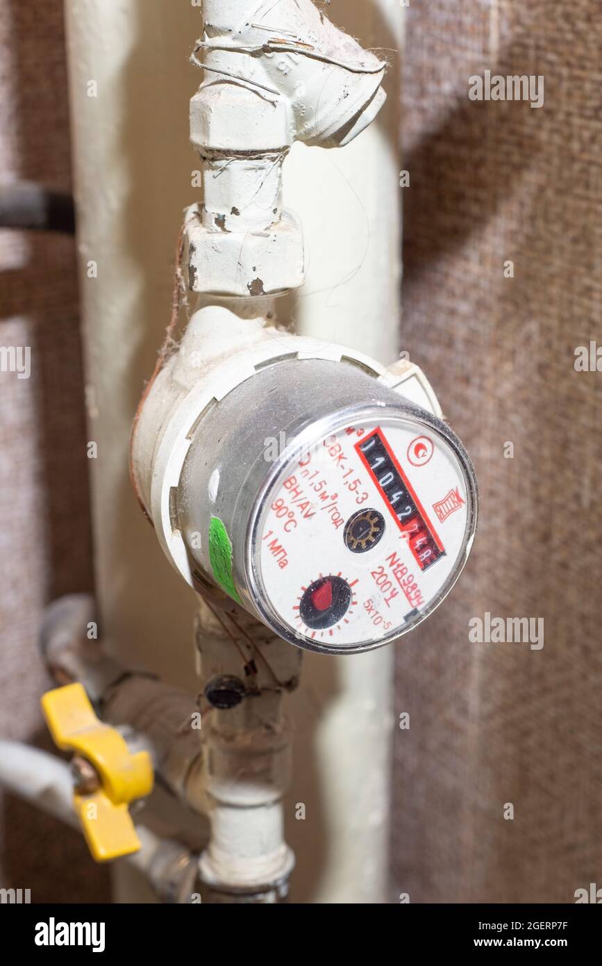 Industrial pressure meter - barometer and water pipes in the background ...