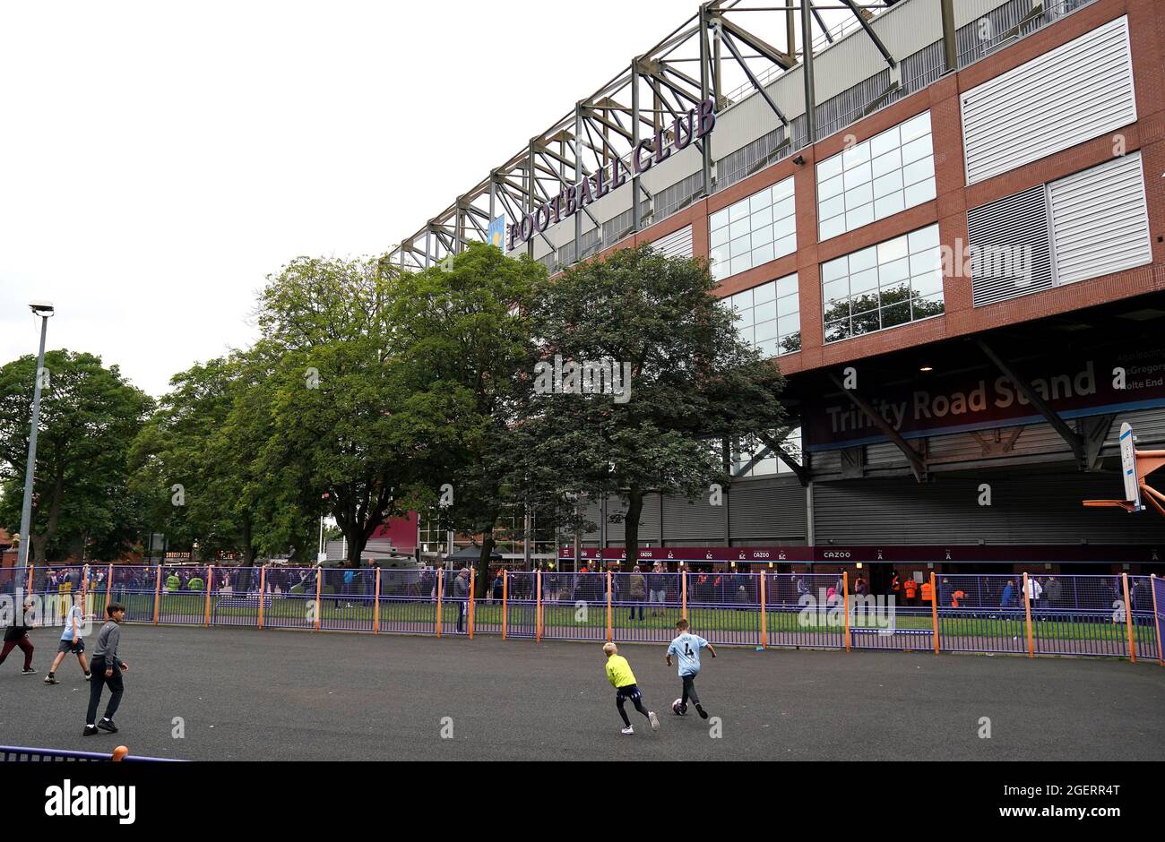 Kids play football outside the ground hi-res stock photography and ...