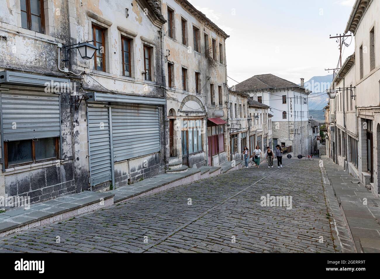 summer cityscape – street of ancient town with souvenir shops and ...