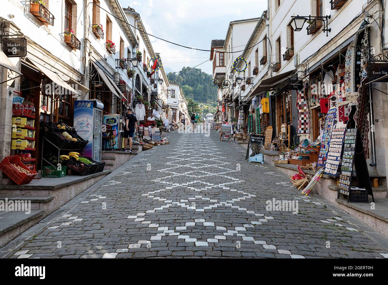 summer cityscape – street of ancient town with souvenir shops and ...