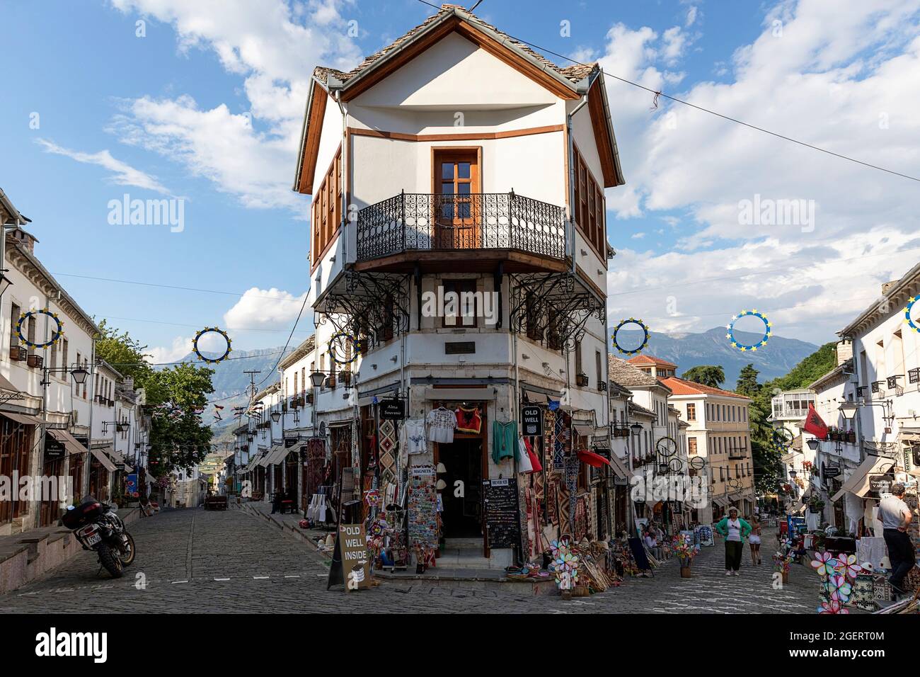 summer cityscape – street of ancient town with souvenir shops and ...